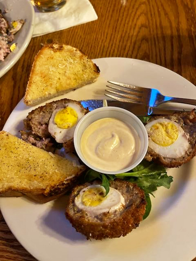 Scotch eggs &ndash; where breakfast meets engineering. Perfectly cooked eggs wrapped in savory sausage armor, then fried to golden perfection. Renaissance painters missed their chance.