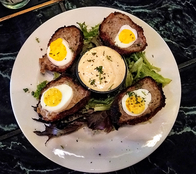 Scotch eggs that would make a Glaswegian weep with joy&mdash;perfectly cooked eggs wrapped in savory sausage, served with a side of nostalgia.