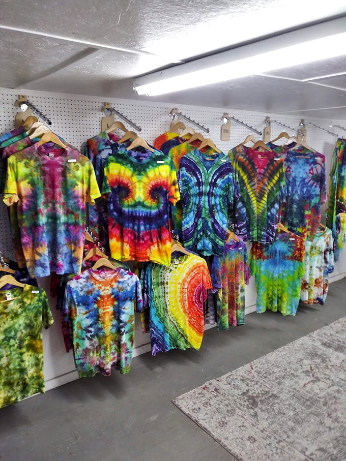 Tie-dye shirts hang like a rainbow explosion, bringing Woodstock vibes to the Florida sunshine.