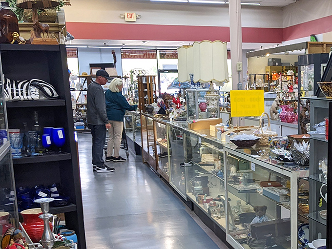Glass display cases create miniature museums of everyday treasures, where shoppers browse with the focus of archaeologists on a promising dig.