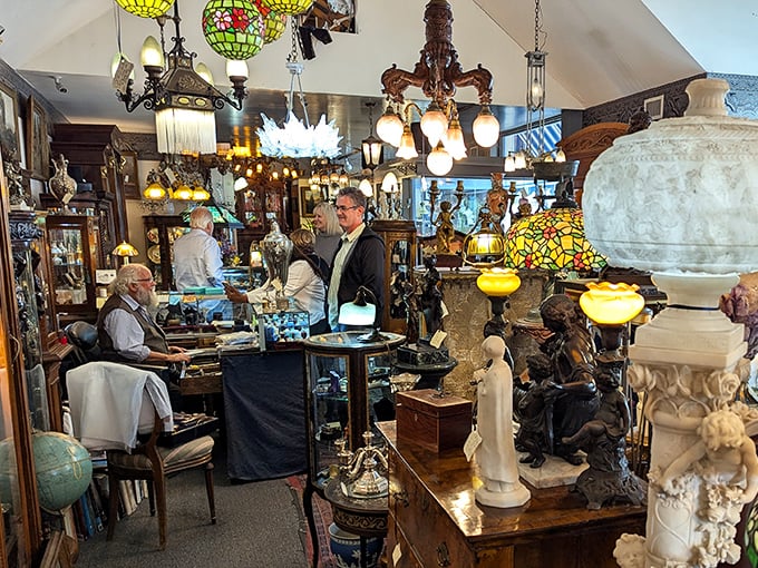The store interior reveals the organized chaos of true antiquing paradise, where shoppers discover treasures amid the carefully curated collections.
