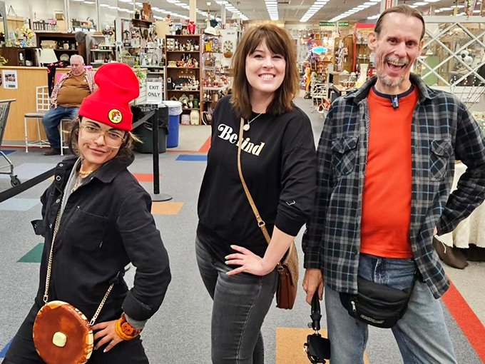 Happy hunters sharing their finds! The thrill of discovery brings people together in these aisles, where strangers become friends over shared nostalgia.