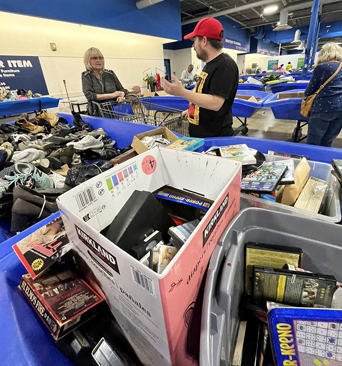 The blue bin battlefield, where seasoned treasure hunters strategize their approach like chess masters contemplating their next move.