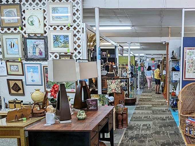 Aisles designed for serendipity, where shoppers disappear between vendor stalls only to emerge triumphantly clutching their newfound treasures.