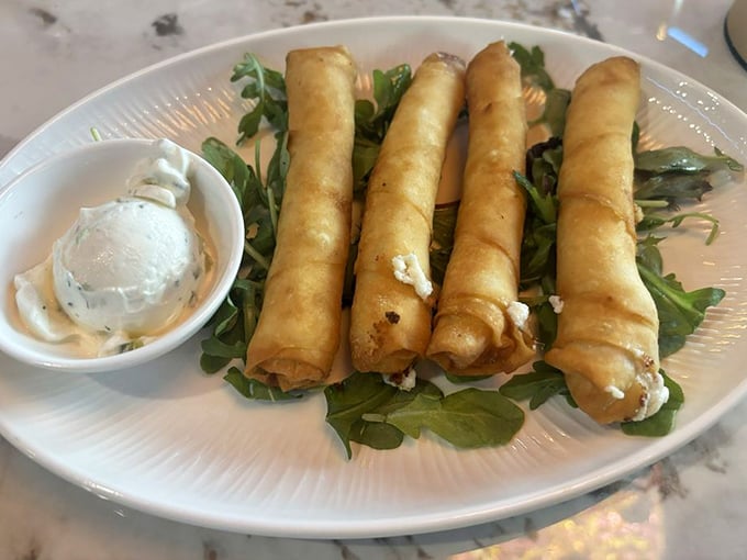 Crispy sigara boregi, filled with cheese and herbs, arrive like edible magic wands that could make your diet disappear with one delicious bite.