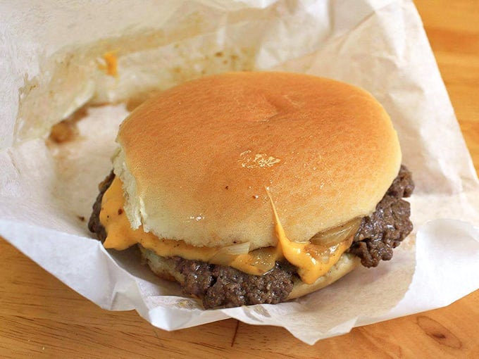 The slider-style burger in its purest form&mdash;a juicy patty, melted American cheese, and a soft bun. No distractions, just deliciousness.
