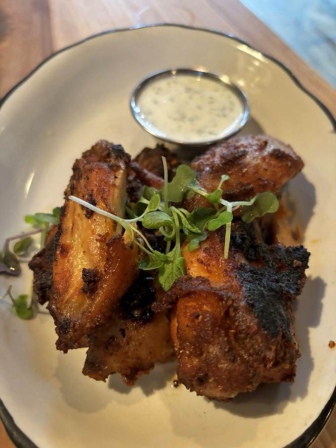 These aren't just wings; they're smoke-kissed flavor bombs with a dipping sauce so good you'll contemplate drinking it when no one's looking.