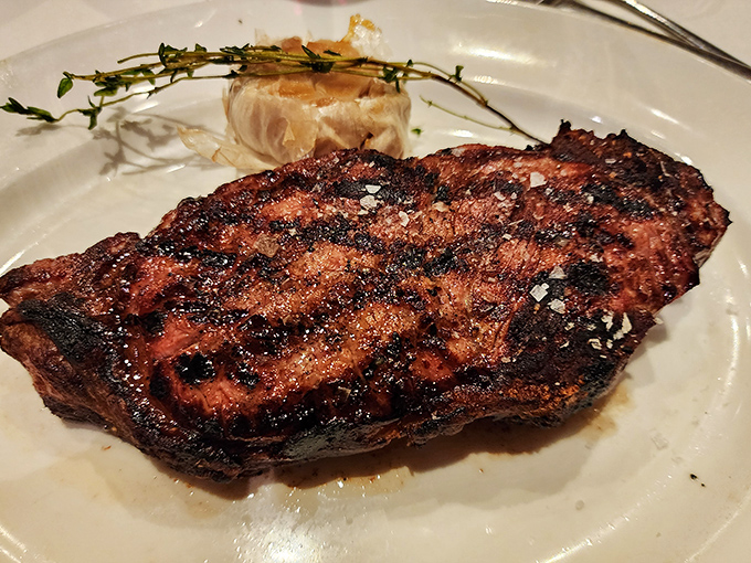 A beautifully charred ribeye that's seen just the right amount of flame. The steak whisperer has spoken, and what they've said is "medium-rare magnificence."