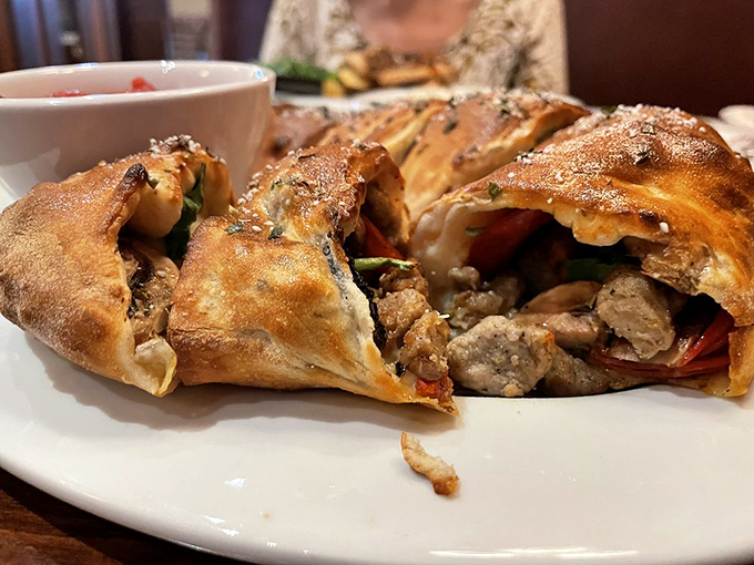 Behold the legendary stromboli in its natural habitat&mdash;golden-brown, bursting with fillings, and practically begging to be photographed before devoured.