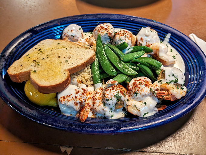 These shrimp nestled in creamy sauce aren't just dinner&mdash;they're a religious experience with garlic bread for communion and snap peas for salvation.