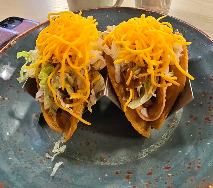 Tacos that don't care what time your watch says. That melted cheese cascade is performing gravity-defying feats worthy of Olympic medals.