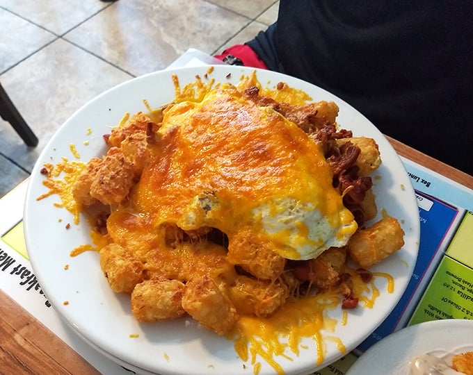 What happens when tater tots meet melted cheese and eggs? The breakfast equivalent of winning the lottery without having to share.