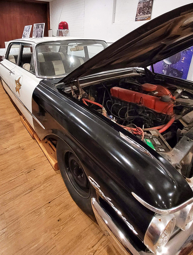 Not just any vintage police cruiser—this black and white beauty with its original engine could have starred in every small-town sheriff movie from the 1950s.