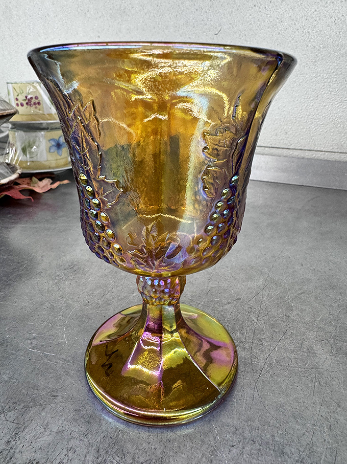 Amber iridescence catches light like liquid gold. This vintage goblet has probably seen more interesting dinner conversations than most of us.
