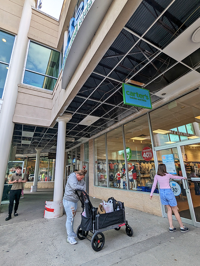 The Carter's storefront welcomes families with strollers full of shopping bags and children who've been promised "just one more stop."