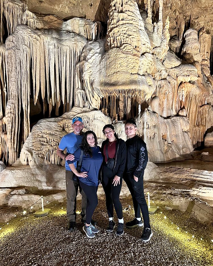 Visitors stand in awe of formations that began growing when dinosaurs roamed the earth. The cave makes for memorable family photos with a prehistoric backdrop.