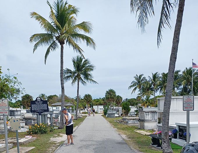 Visitors stroll the palm-lined pathways, where history lessons come with a side of tropical breeze and fascinating epitaphs.