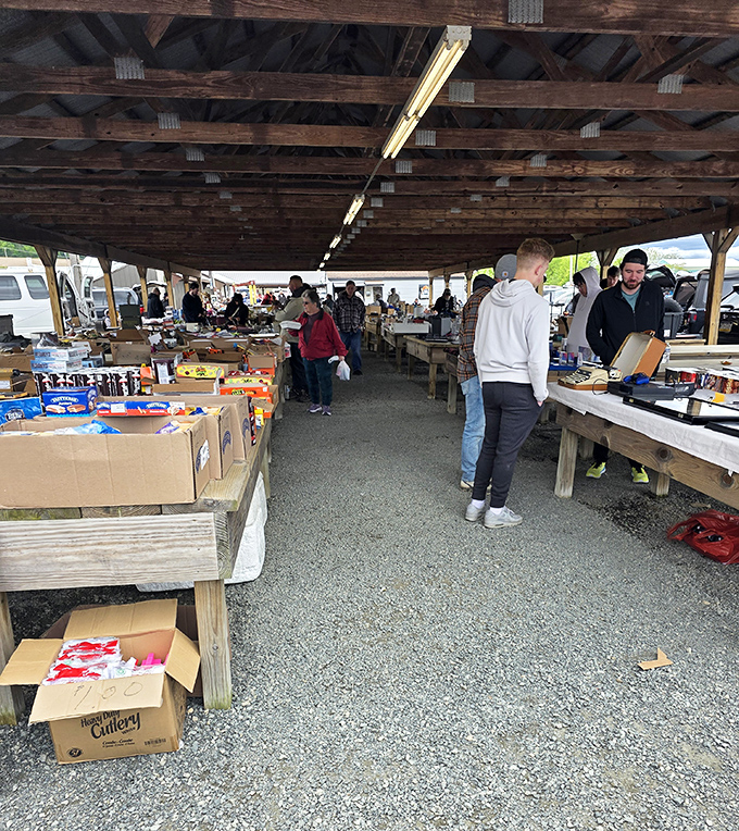 Serious collectors examine merchandise with the focus of art appraisers at Sotheby's, knowing value often hides in plain sight.