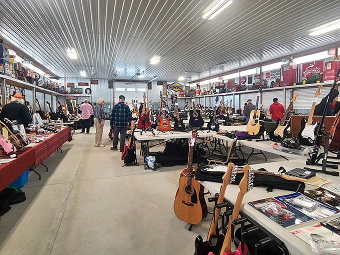 A guitarist's paradise where vintage six-strings hang like ripening fruit, waiting for the right hands to make them sing again.