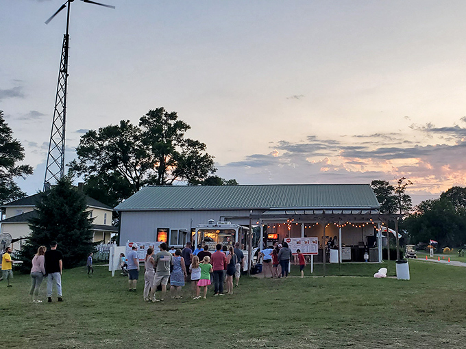 The concession area becomes the social hub of the drive-in, where strangers become temporary neighbors united by buttery popcorn and movie anticipation.