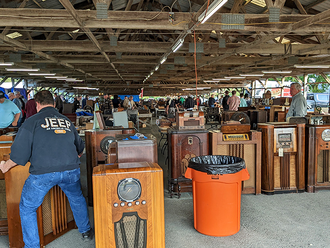 Vintage radios stand at attention like wooden sentinels from another era, each with stories to tell through static-filled memories.