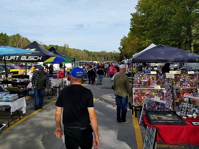 NASCAR tents and collectible displays create a colorful gauntlet of temptation that would test even the most disciplined shopper's resolve.