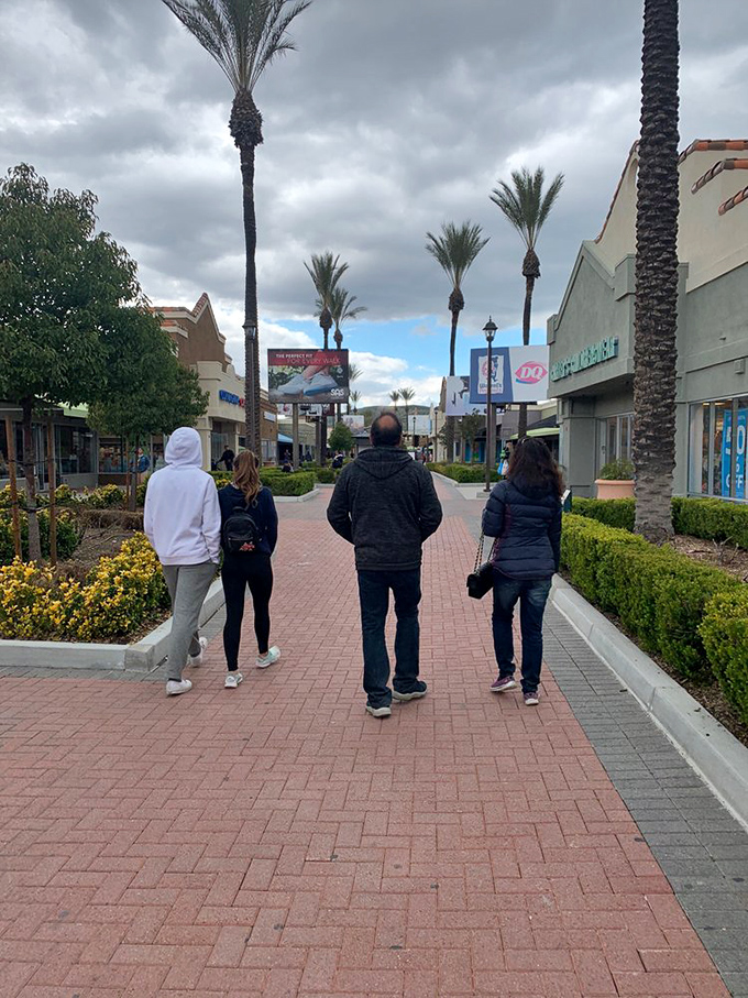 Fellow treasure hunters on the trail of deals. Notice the purposeful stride &ndash; these are professionals who know exactly where the clearance racks hide.
