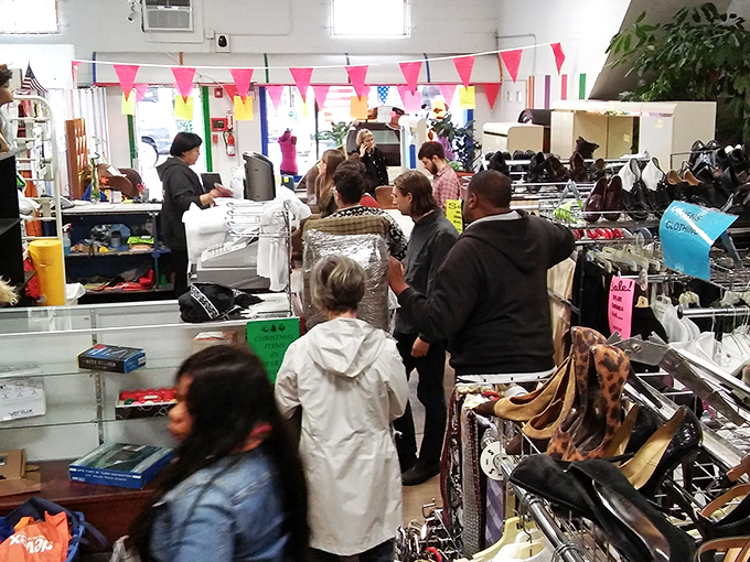 Bargain hunters navigate the crowded aisles with the focus of archaeologists, each hoping to unearth that perfect find among the racks.
