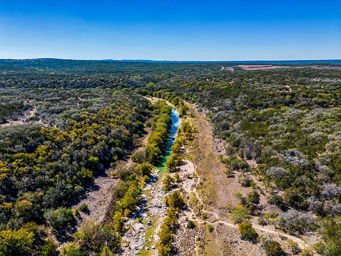Nature's highway stretches to the horizon, carving a blue ribbon through the rugged Texas landscape. No traffic jams here!