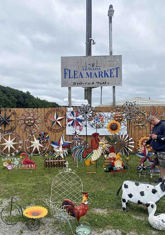 Armada Flea Market's rustic sign and colorful displays create an authentic outdoor shopping experience under open skies.