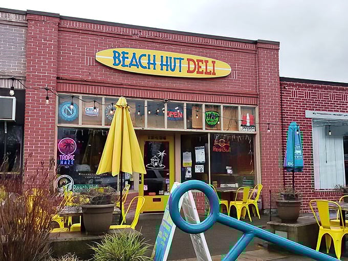 Beach Hut Deli's surfboard-bright exterior brings California beach vibes straight to suburban Tigard's busy streets.