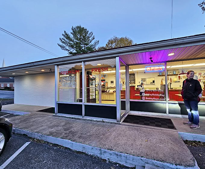 Bobby Bay's glowing storefront welcomes evening sandwich seekers. Even after dark, the promise of perfect sandwiches shines bright in Lancaster.