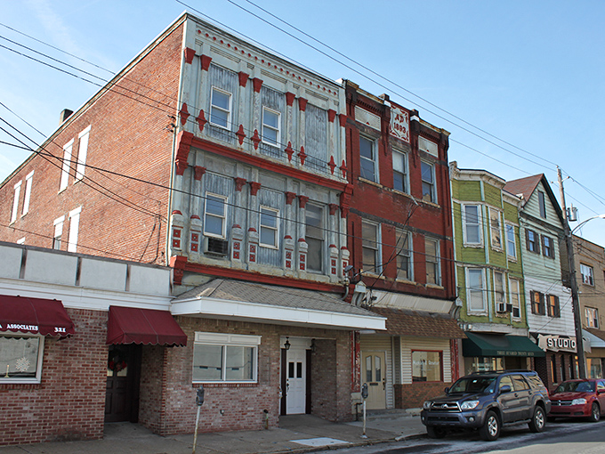 Charleroi's main street offers a glimpse into the town's industrial past with well-preserved buildings now housing affordable businesses.