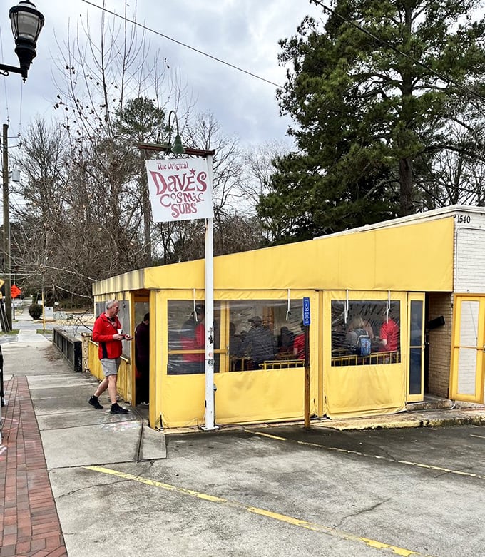 Dave's Cosmic Subs' sunny yellow exterior practically glows with the promise of stellar sandwich satisfaction ahead.