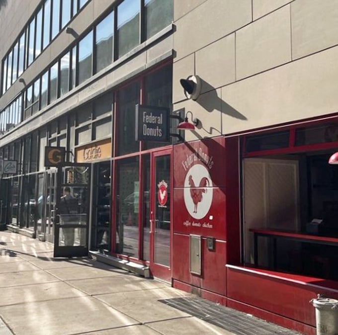 That bold red storefront doesn't whisper - it announces serious donut business with urban confidence.
