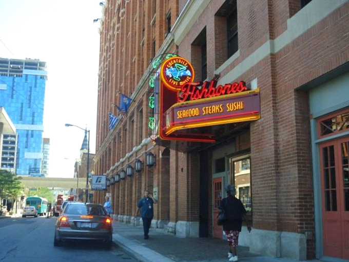 Fishbones lights up Greektown with neon promise. That sassy little crab on the sign knows exactly what you're in for&mdash;a seafood party!