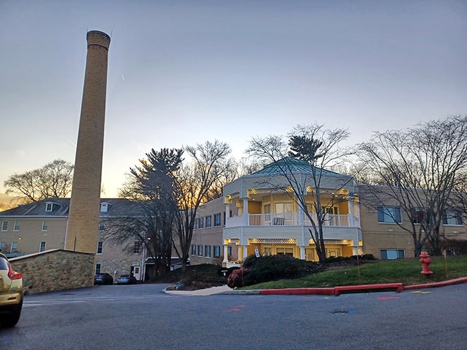 That historic smokestack tells stories while modern buildings promise comfortable chapters ahead for residents.