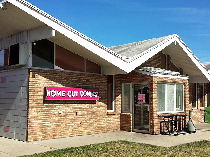 Pink neon against brick speaks the universal language of comfort food done right in Joliet.