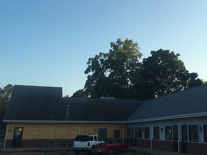 The evening light hints at the international flavors waiting inside this unassuming culinary passport office.