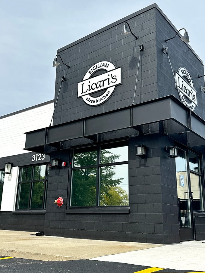 Licari's sleek black exterior suggests serious pizza business - where Sicilian traditions meet modern Michigan appetites.