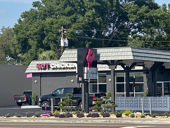 Hot pink accents hint at the Nashville fire waiting inside this sleek Lakeland chicken destination.