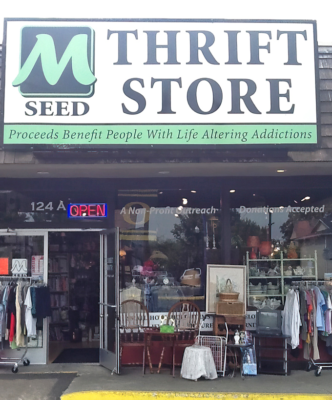 That green storefront stands like a beacon of hope, proving that great deals and good deeds make perfect shopping companions.