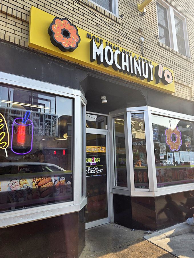 Mochinut's eye-catching yellow sign is like a beacon of joy for the donut-obsessed. Resistance is futile!