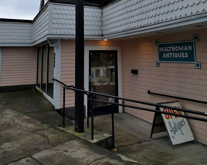 This charming pink cottage proves that the best antique shops often hide behind the most unassuming facades.