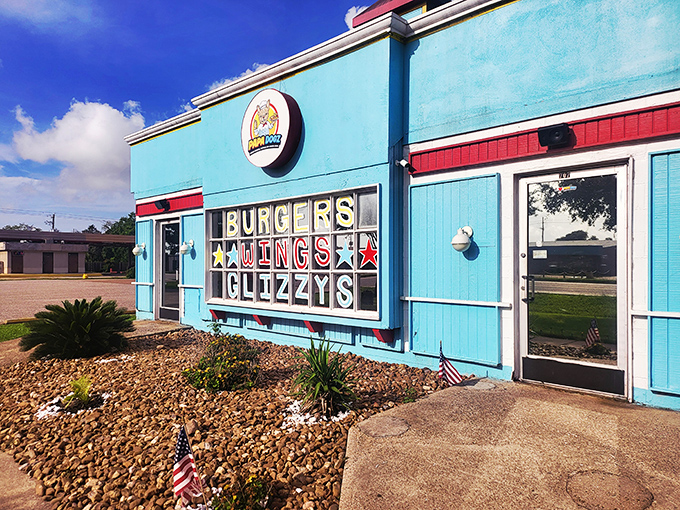 Papa Dogz's vibrant blue building houses a treasure trove of creative hot dog combinations that'll make you rethink what belongs on a bun.