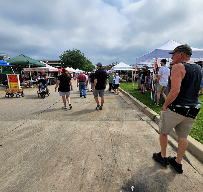 Peoria's riverside market spreads out under open skies. Cardboard boxes transform into treasure chests filled with fresh produce and handmade finds.