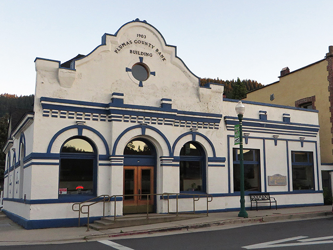 Banking on history! Quincy's architectural gem glows in the golden hour light, its curved parapet a love letter to bygone craftsmanship.