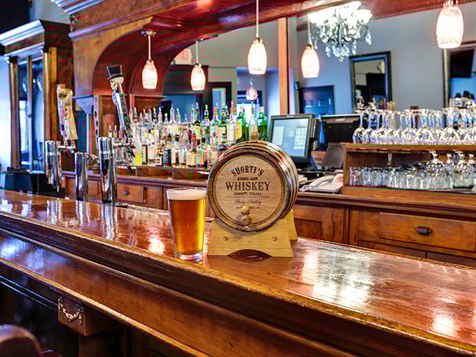 This polished bar setup suggests serious attention to both liquid accompaniments and perfectly grilled beef cuts.