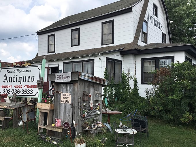 "BE Happy" isn't just a sign&mdash;it's what happens naturally when you discover this white farmhouse filled with rustic treasures and timeworn charm.