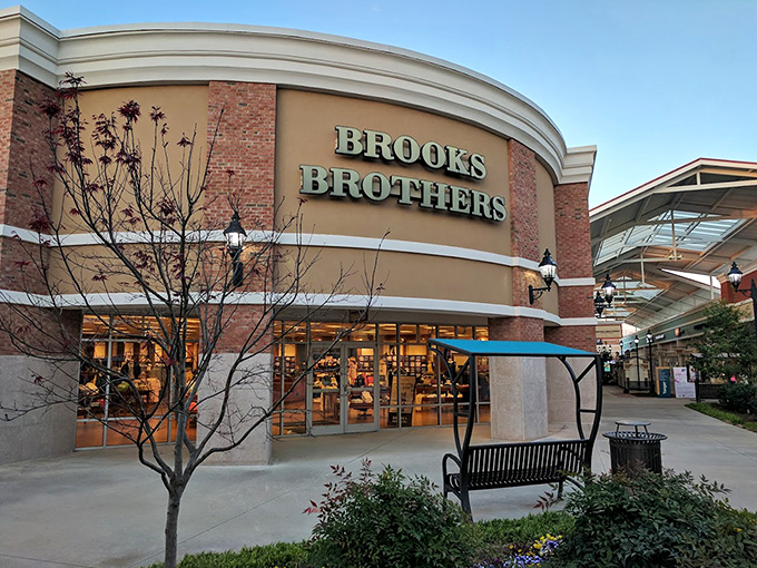Classic brick architecture and thoughtful landscaping create an outlet shopping experience that feels genuinely welcoming.